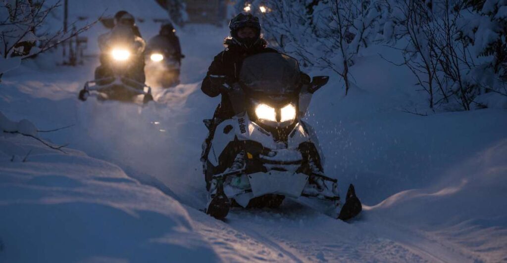 From Tromsø: Evening Snowmobiling Tour at Camp Tamok | The Abroad Guide